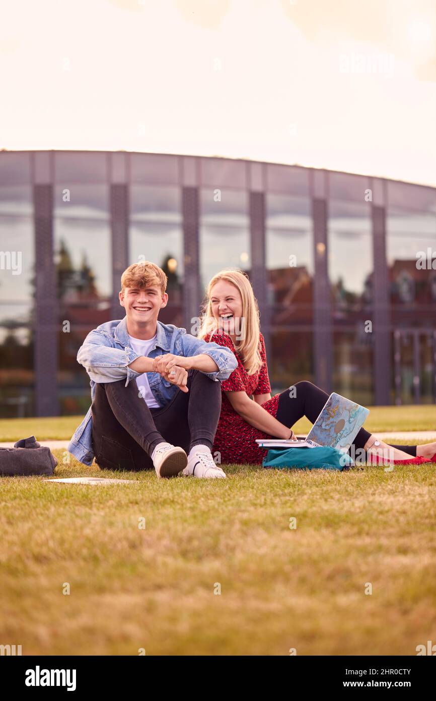 Two women sit on grass hi-res stock photography and images - Alamy