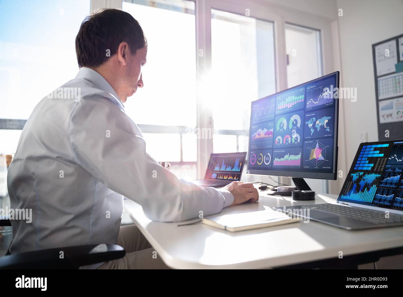 Business Data Analyst Man Using Computer At Desk Stock Photo - Alamy