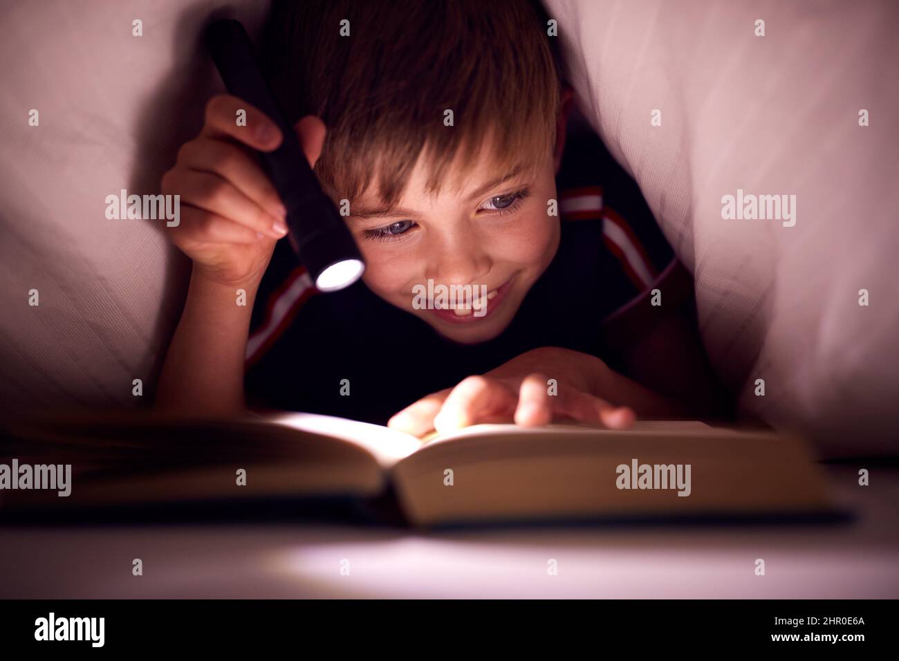 Child face lit by torch hi-res stock photography and images - Alamy