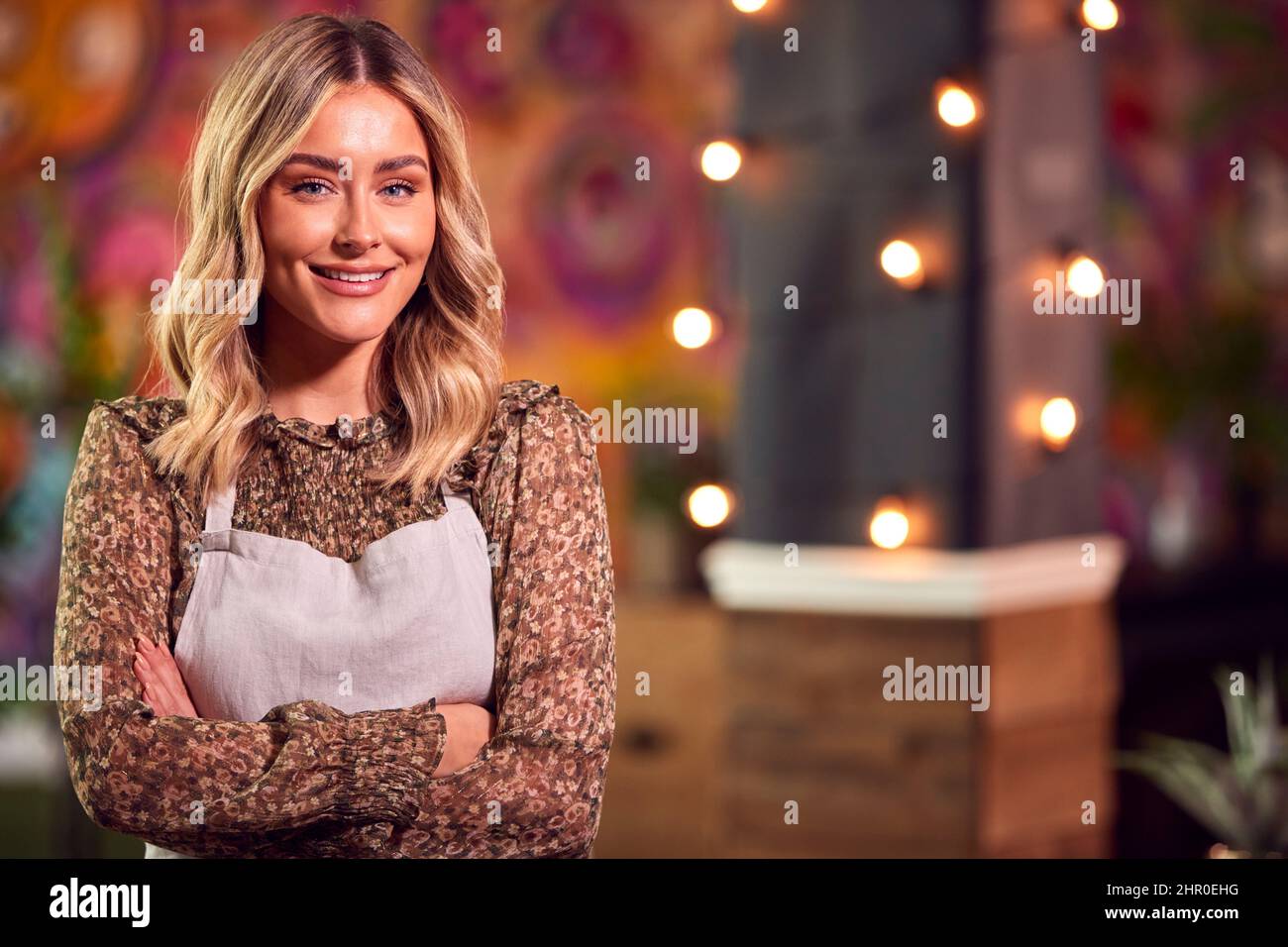 Portrait Of Smiling Female Server Working Night Shift In Bar Restaurant ...