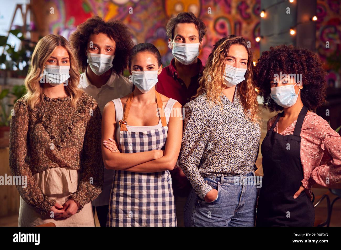 Portrait Of Multi-Cultural Team Of Bar Servers Wearing Face Masks ...