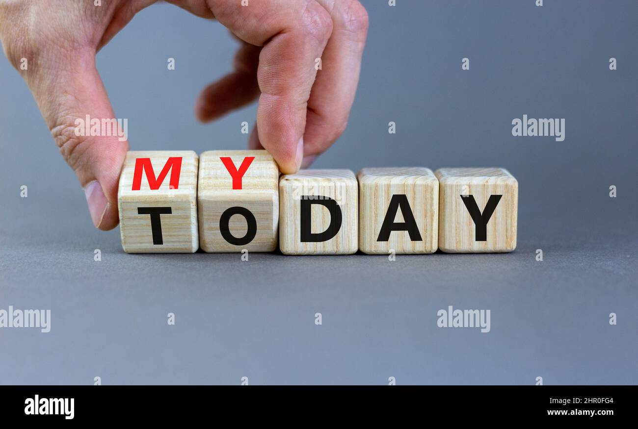 Today is my day symbol. Businessman turns wooden cubes and changes concept words Today to My day ...