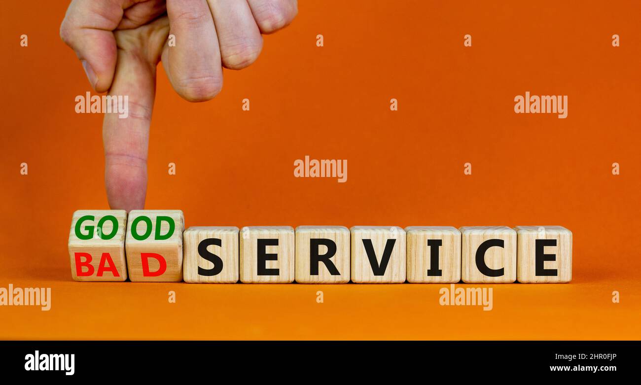 Good or bad service symbol. Businessman turns cubes and changes words ...