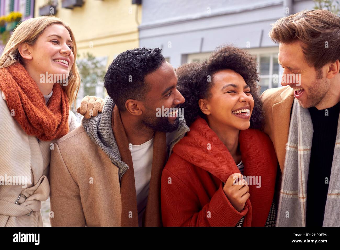 Portrait group friends wearing coats hi-res stock photography and ...