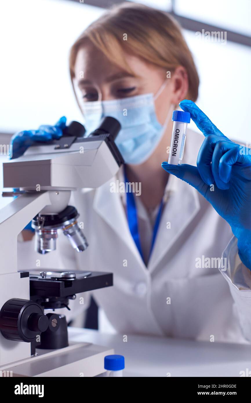 Female Lab Worker Wearing PPE Researching Covid-19 Omicron Variant In ...