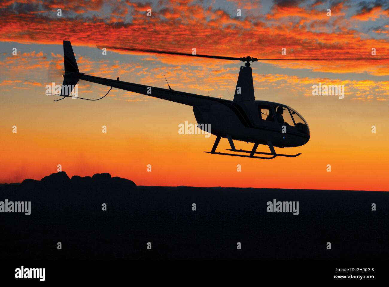 Robinson r44 helicopter at sunset hi-res stock photography and images ...