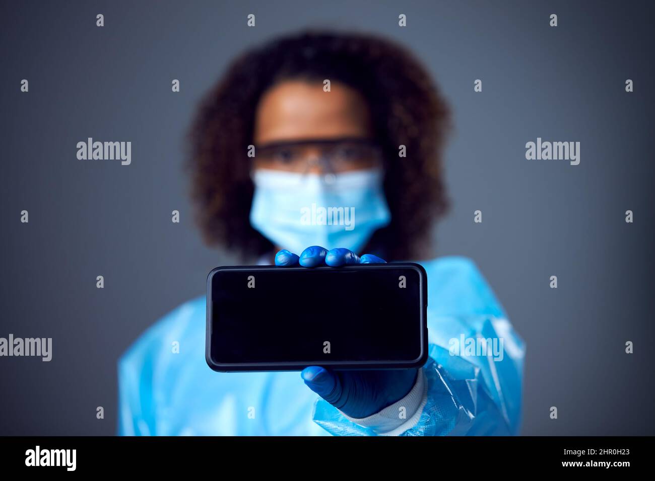 Studio Portrait Of Female Lab Worker in PPE With Face Mask And Safety ...