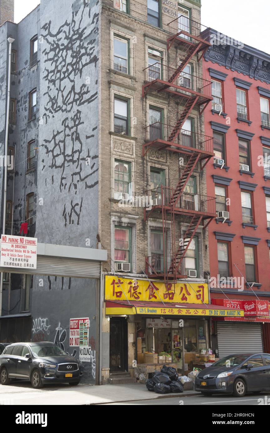 Apartment building along East Broadway in the Chinatown neighborhood of ...
