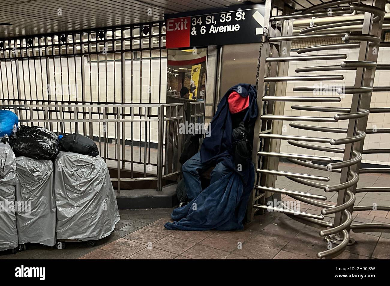 Homeless man sleeping in subway hi-res stock photography and images - Alamy
