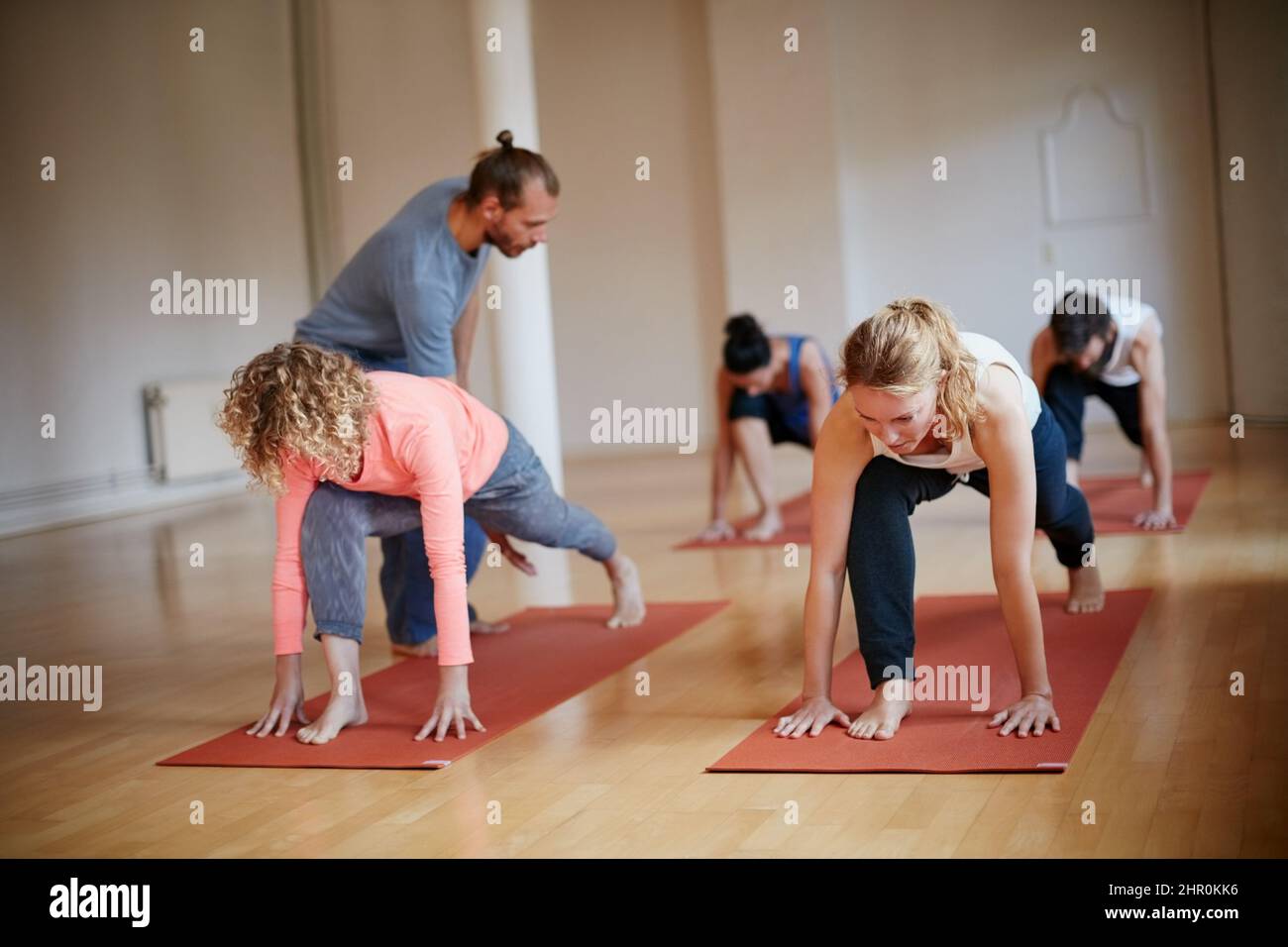 Your yoga instructor is the key to a successful class. Shot of a yoga ...
