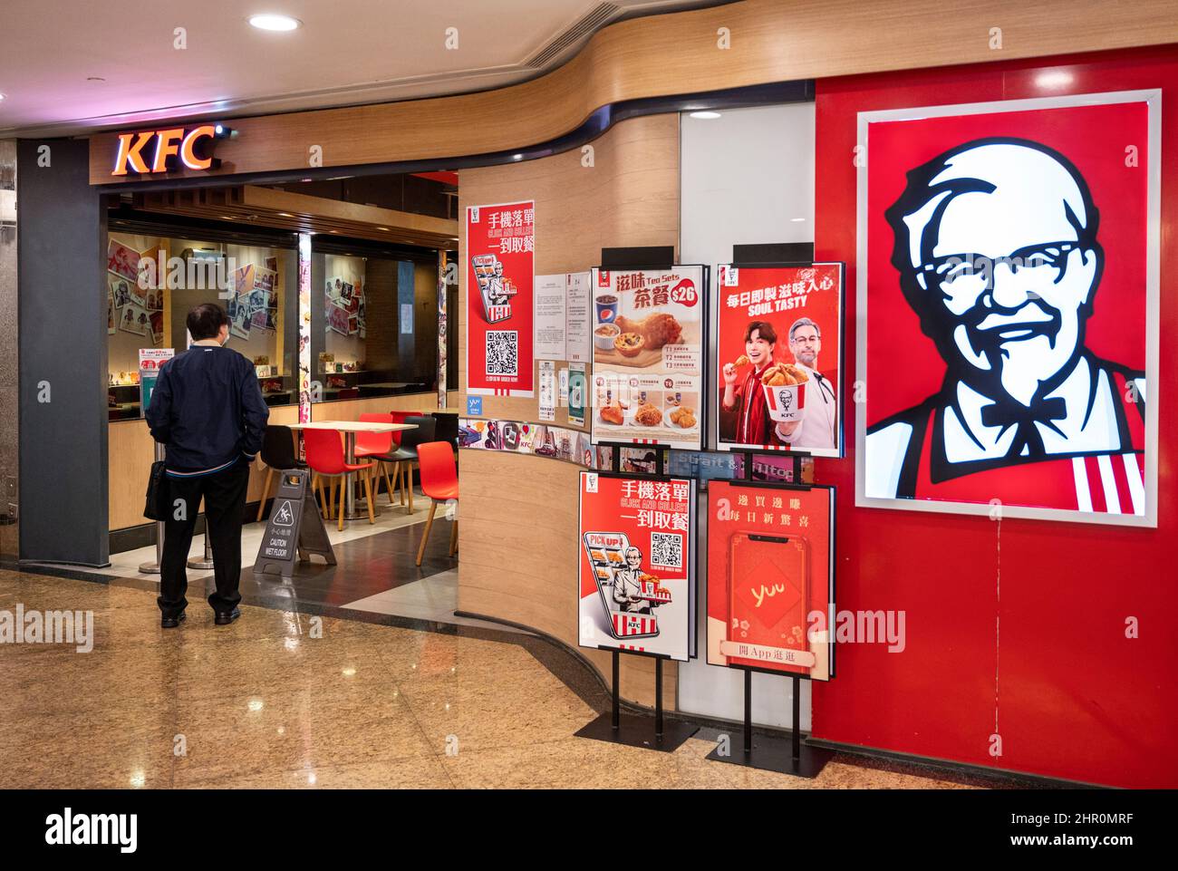 A customer is seen at the American fast food chicken restaurant chain ...