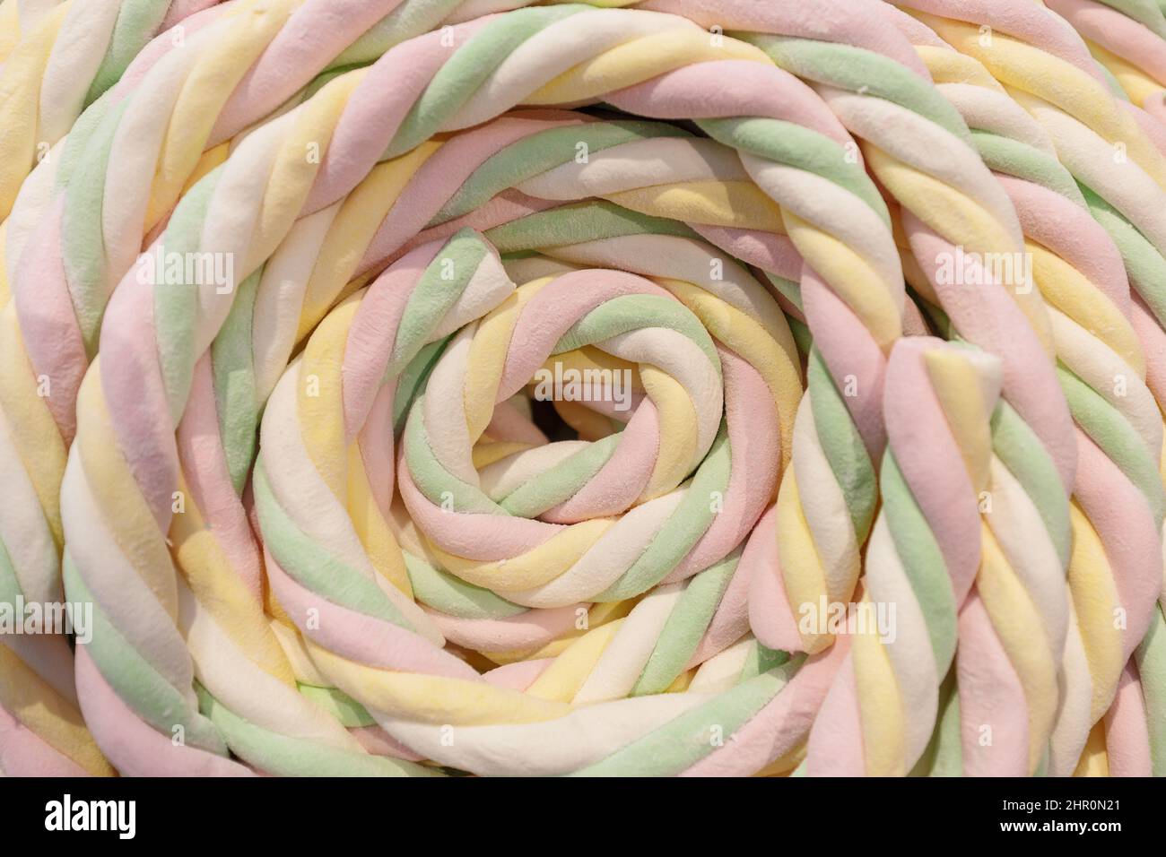Curled bundle of colorful candies Stock Photo - Alamy