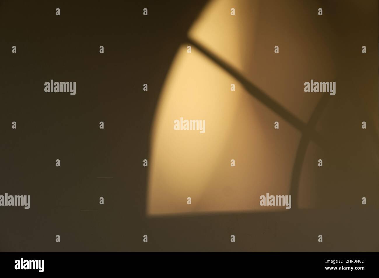 morning sun cast shadow on dark wall through old arch window - hope ...