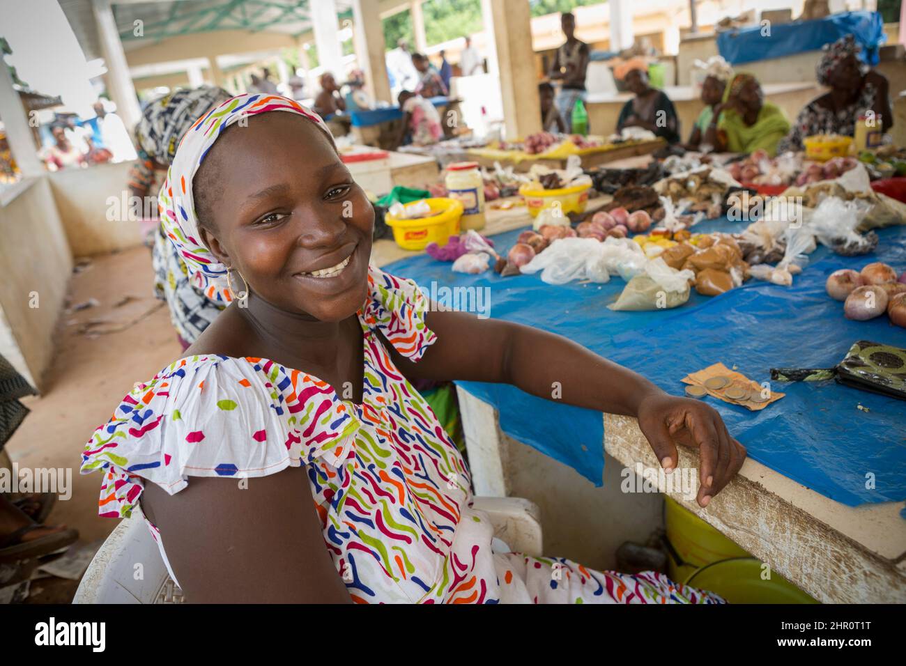 An African woman sells produce at her market stall in Tanaff, Senegal ...