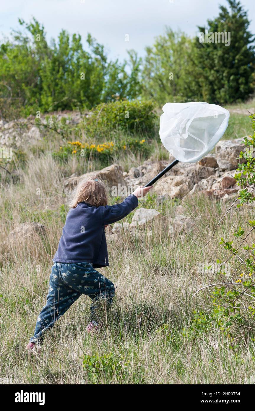 Girl hunting butterflies, Ardeche, France Stock Photo - Alamy