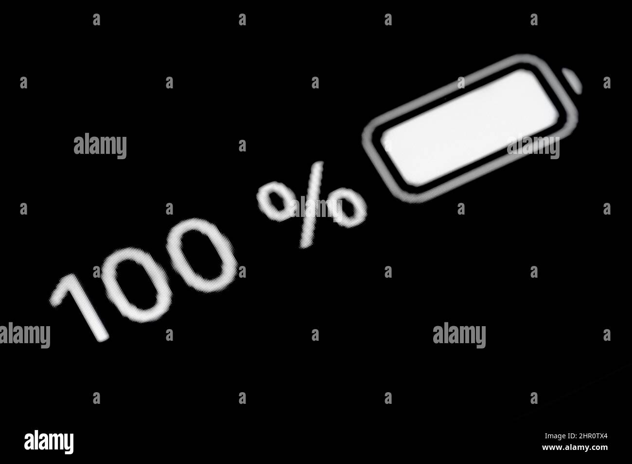 Smartphone full charged battery level indicator - 100 percent: close up ...