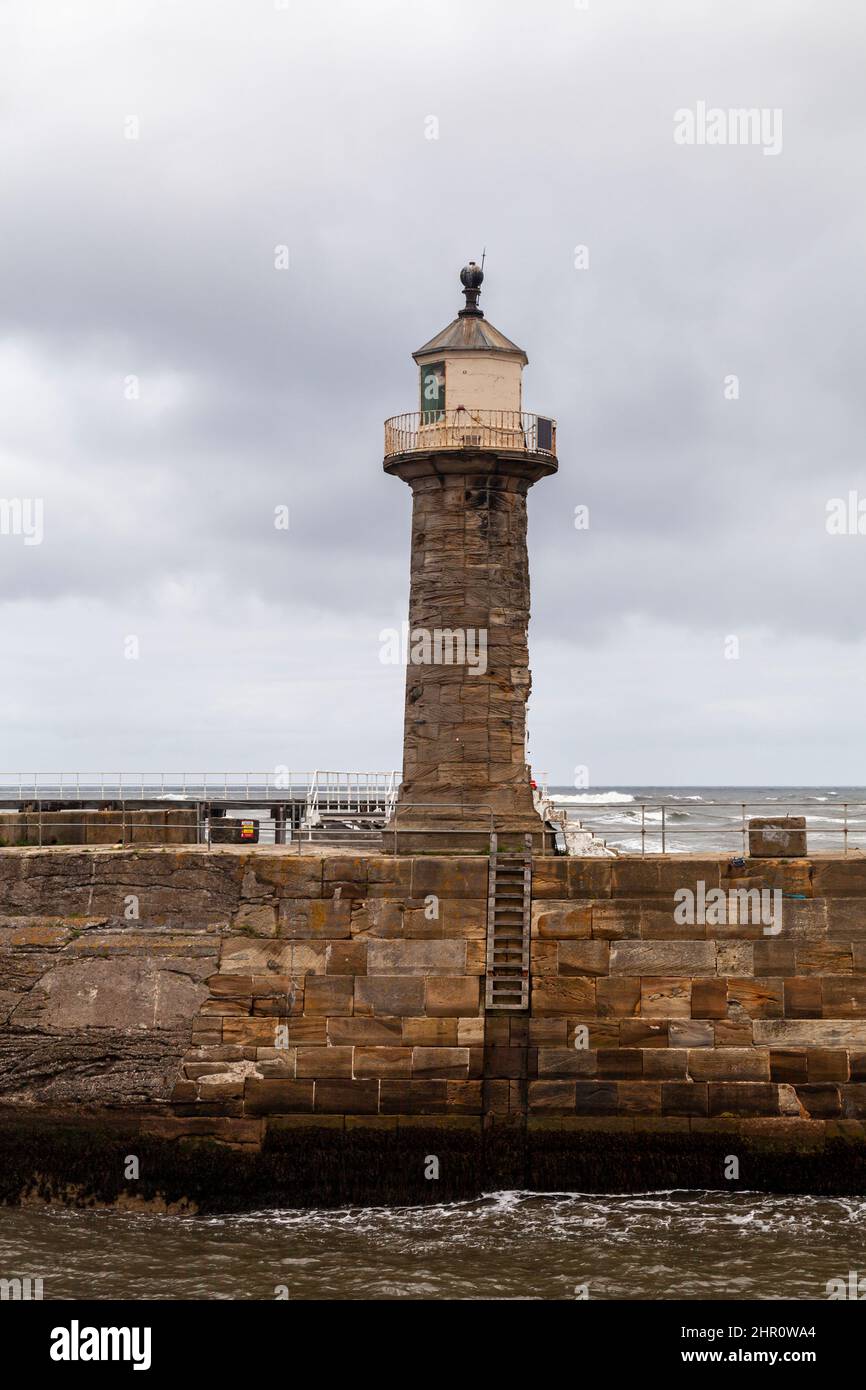 Old lighthouse at the end of Whitby Harbour, Yorkshire Stock Photo - Alamy