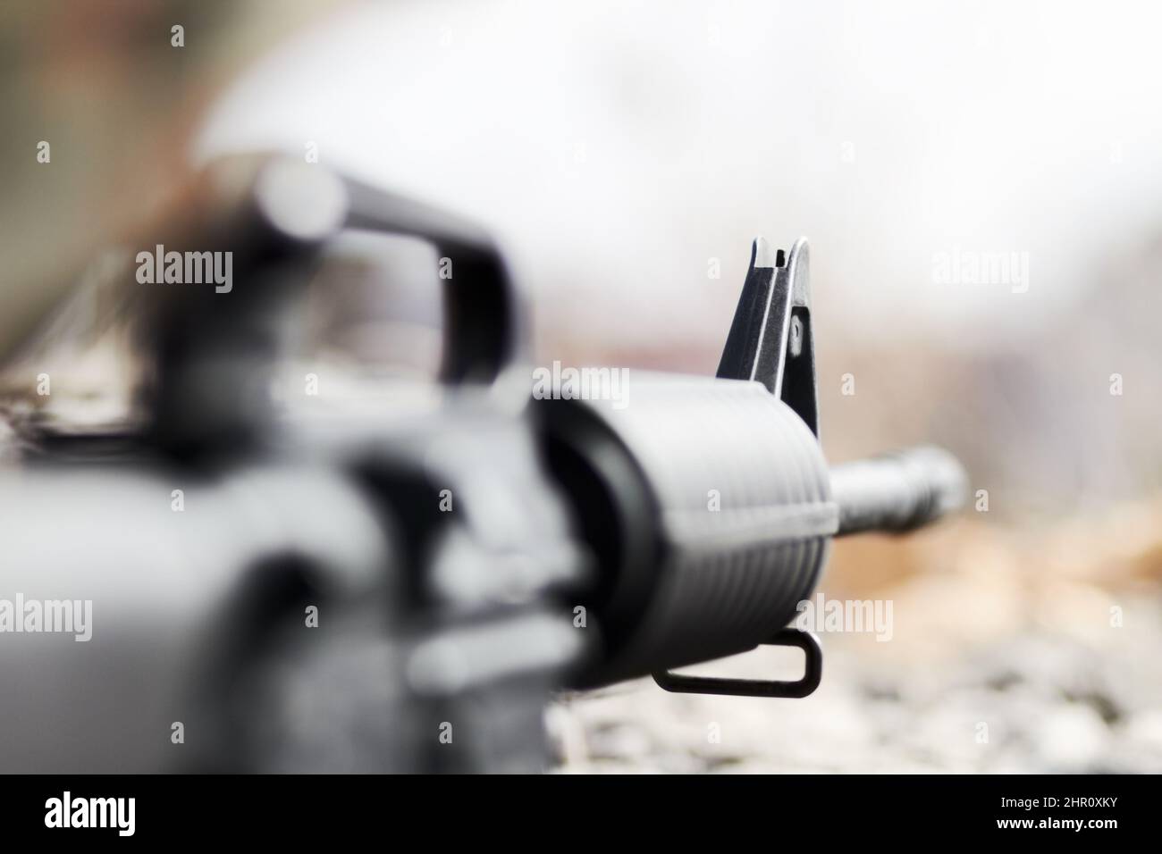 Weapons of war. Rearview closeup and selective focus of a barrel of a ...