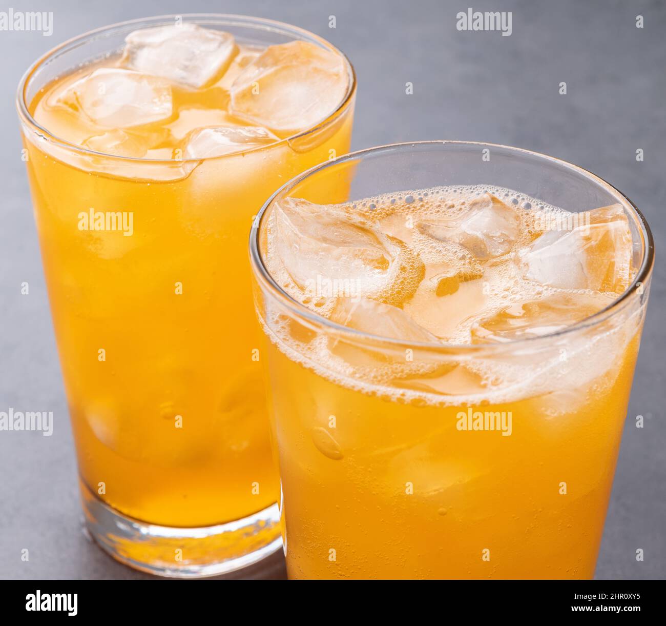 Orange soda, soft drink in cups with ice Stock Photo - Alamy