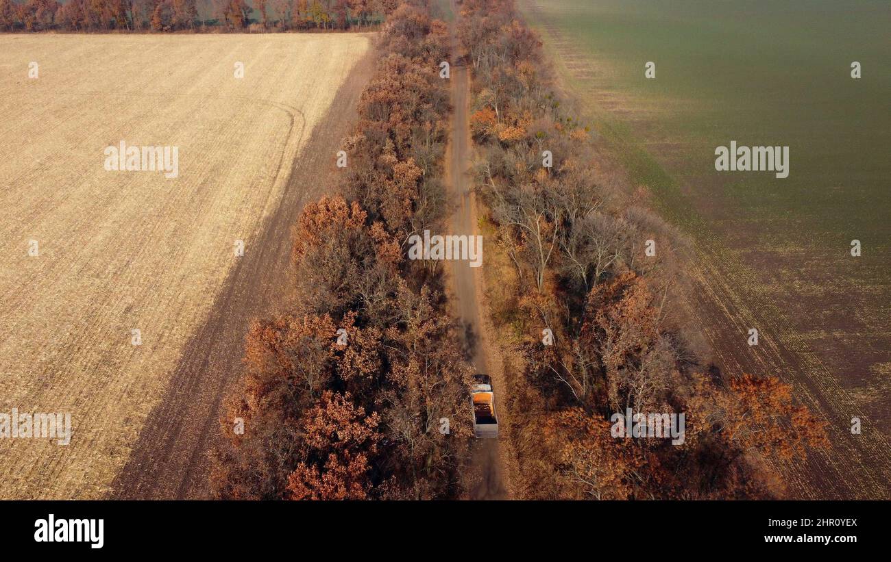 Aerial Drone View Flight Over Truck with an Empty Body Driving Along ...
