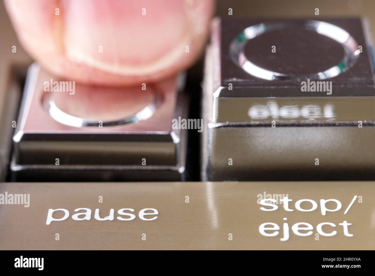 Finger pressed a pause button of a vintage tape recorder macro Stock ...