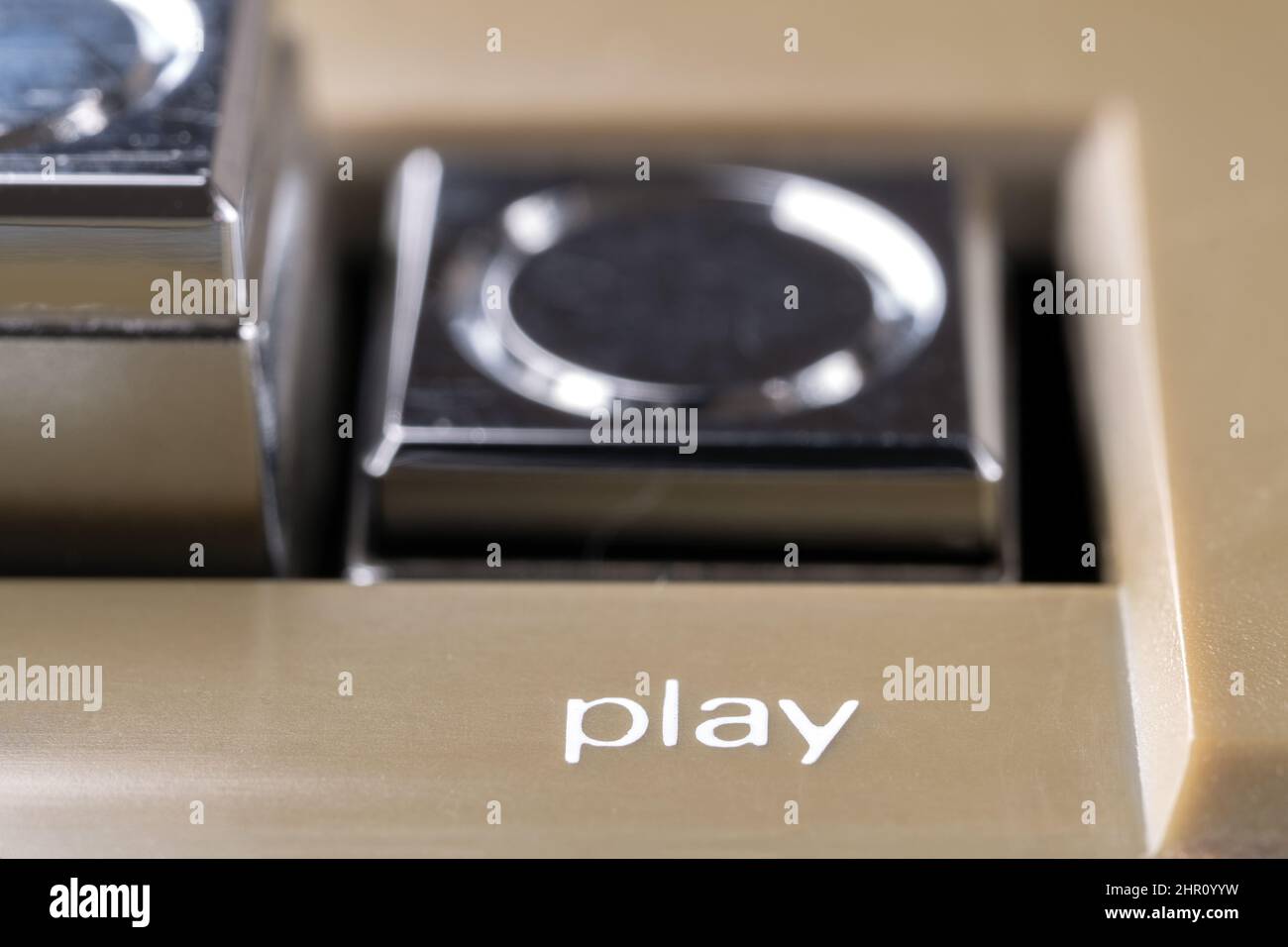 Pressed play button of a vintage tape recorder macro Stock Photo - Alamy