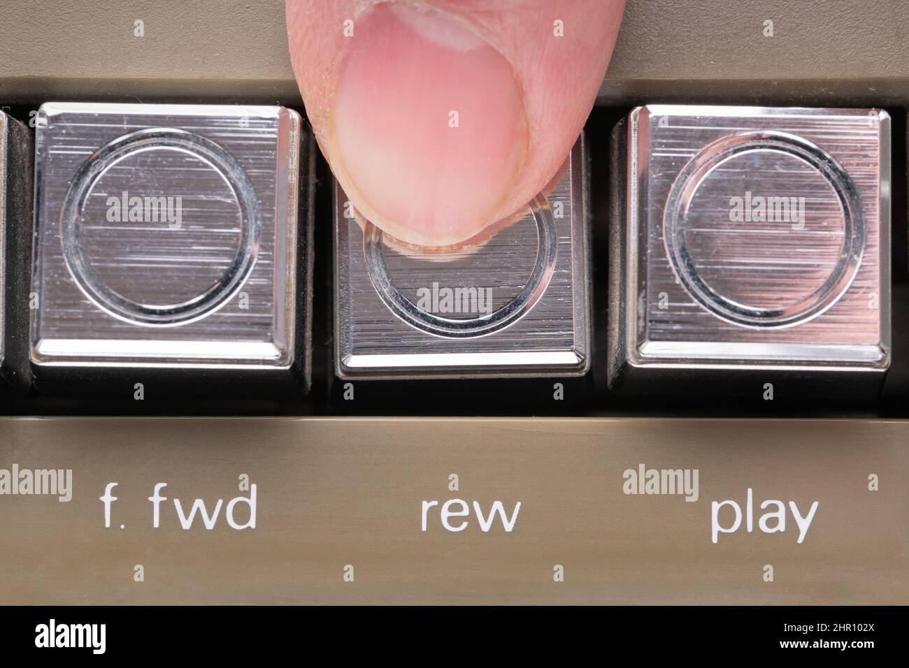 Finger pressed a rewind button of a vintage tape recorder macro Stock ...