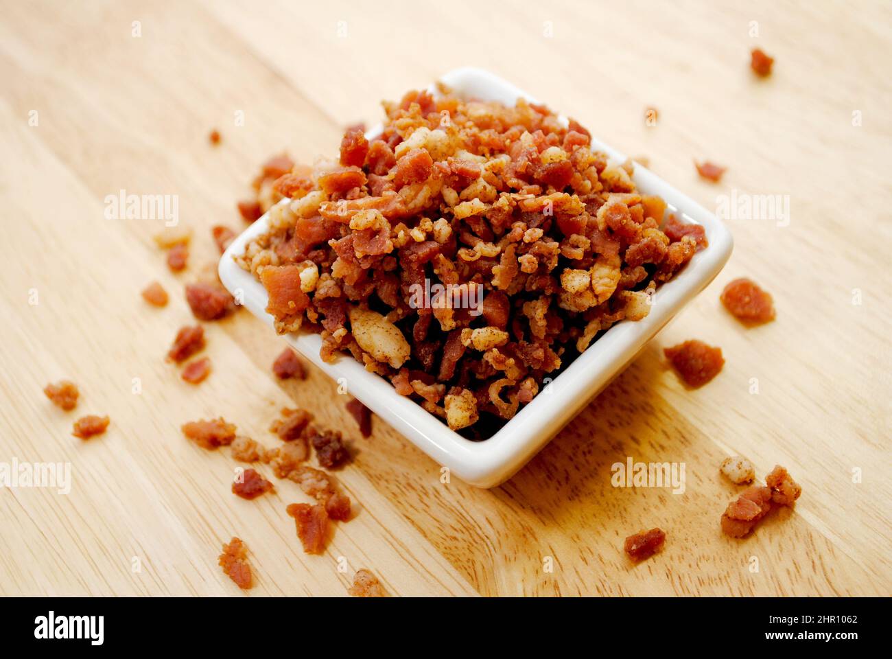 Crisy Bacon Bit Overflowing from a Square White Bowl Stock Photo - Alamy