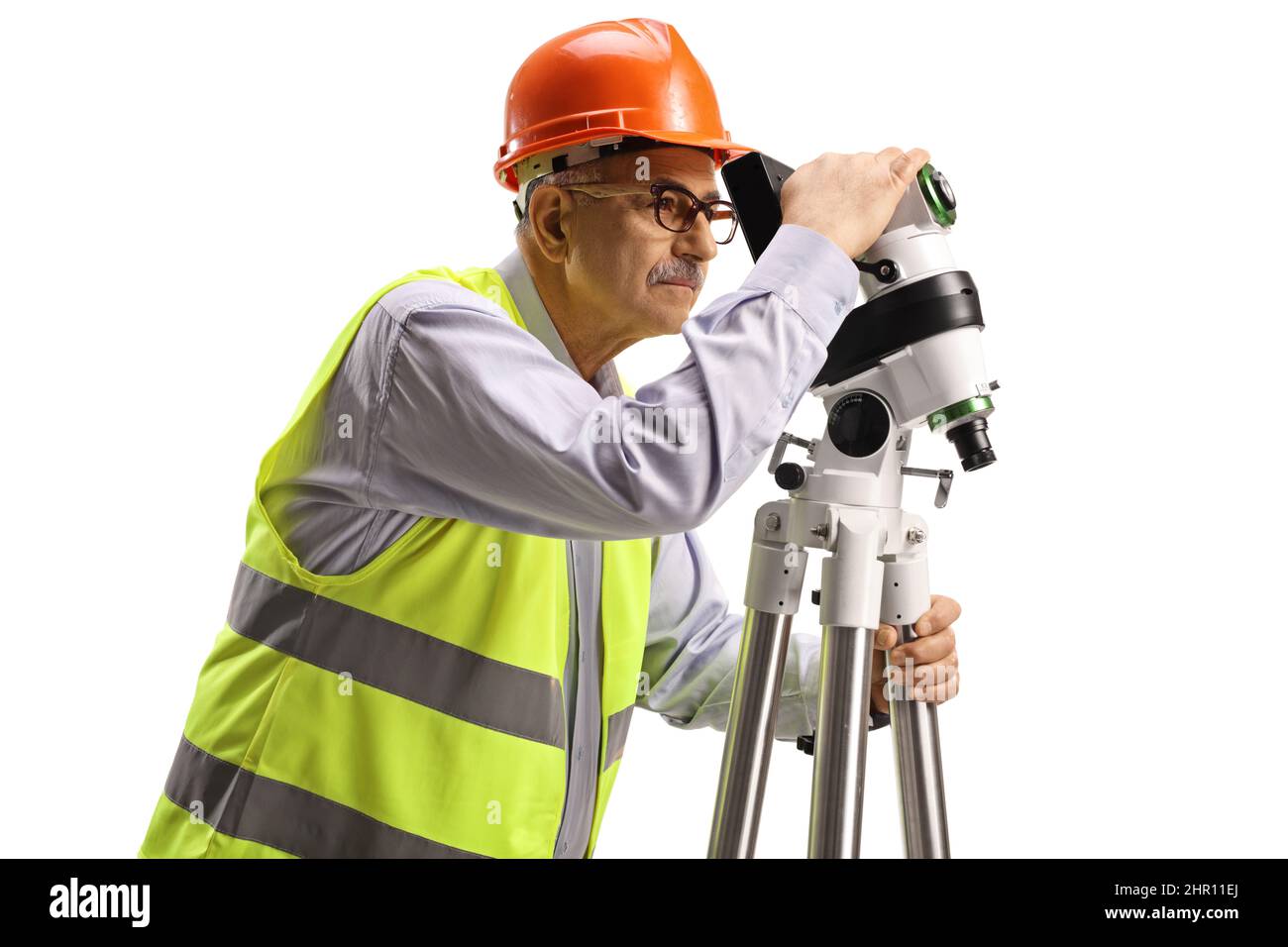 Engineer measuring with a positioning station isolated on white ...