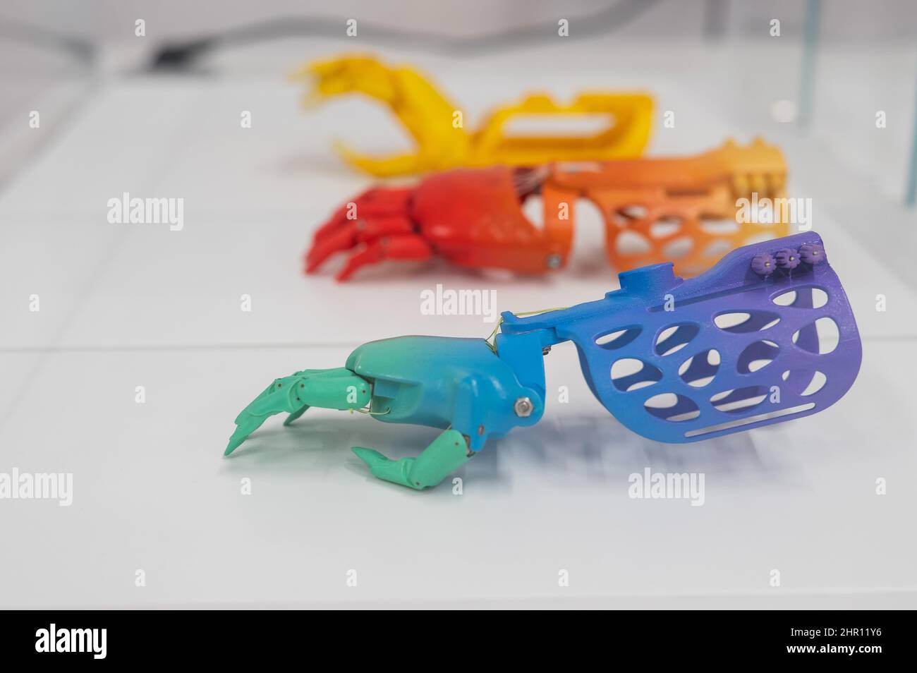 Samples of multi-colored children's prosthetic hands made of 3D plastic ...