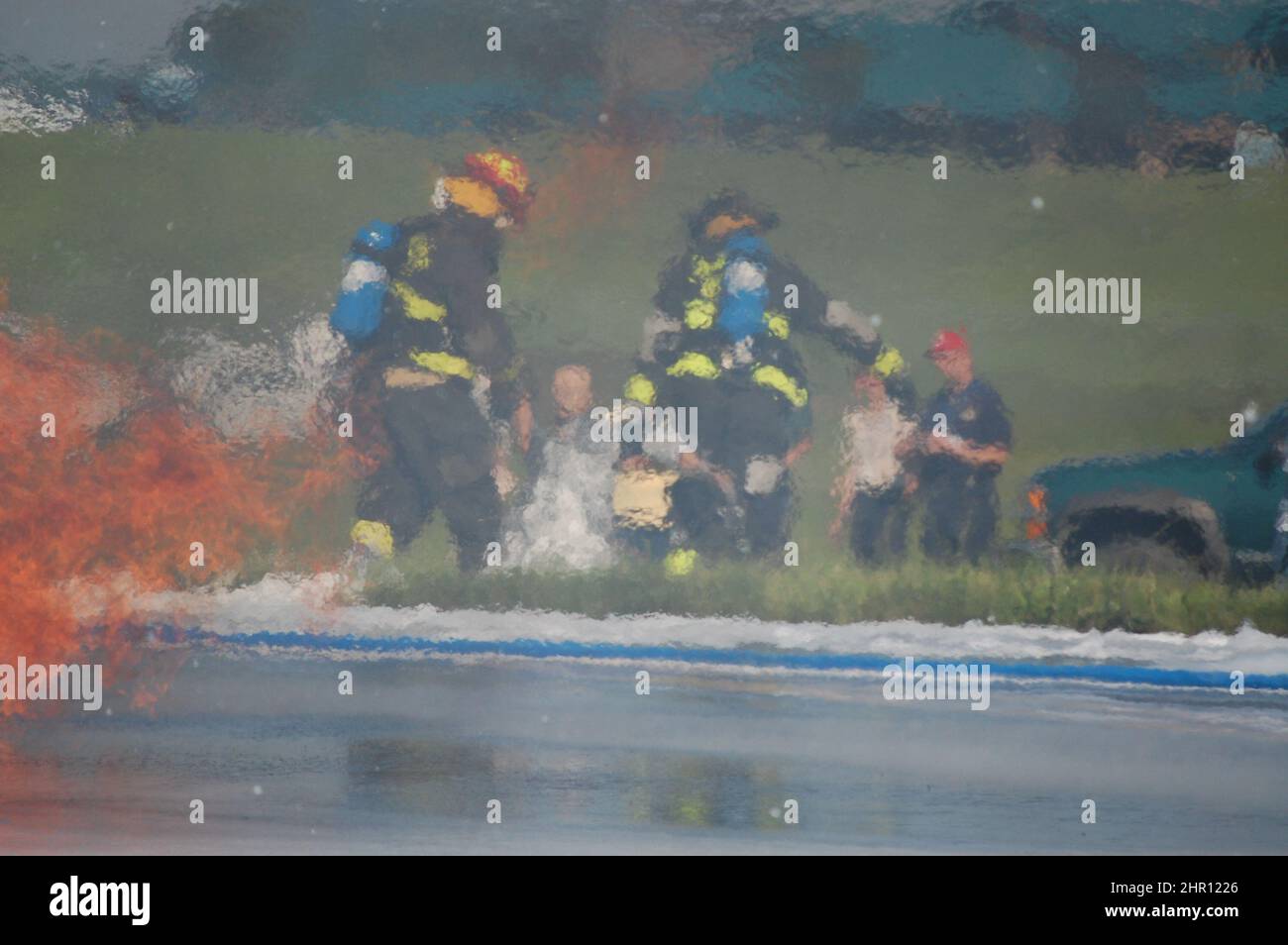 Two firefighters rescuing victim Stock Photo - Alamy
