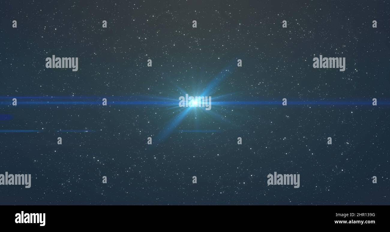 Image of glowing blue light moving over spots of light and stars in ...