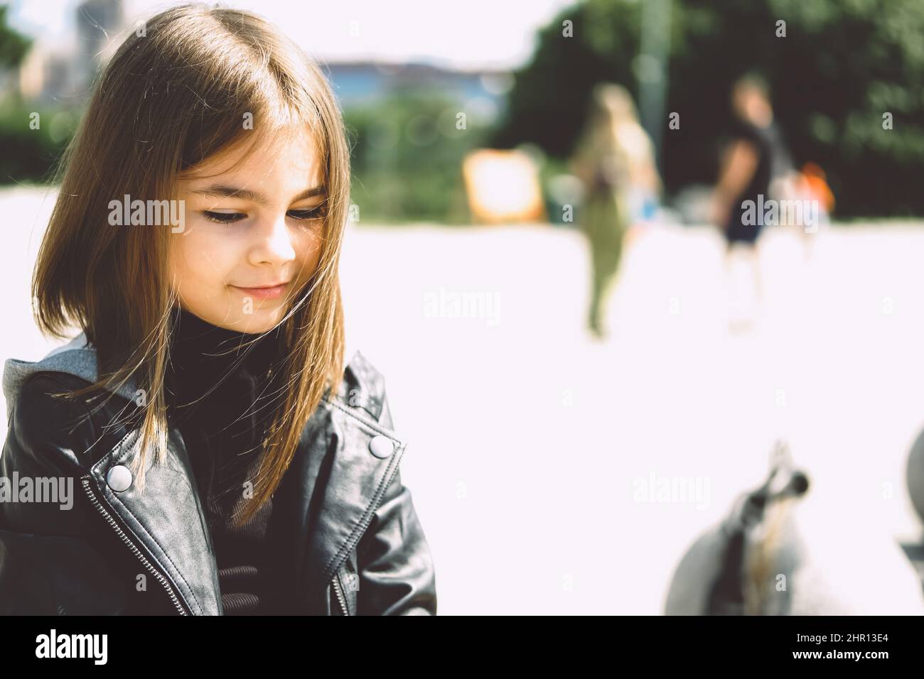Happy girl with red pinwheel walking outdoors Stock Photo - Alamy