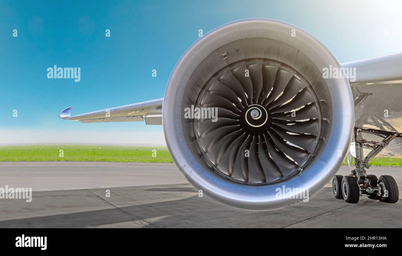 Aircraft jet engine close-up, airplane wing and chassis of landing gear ...