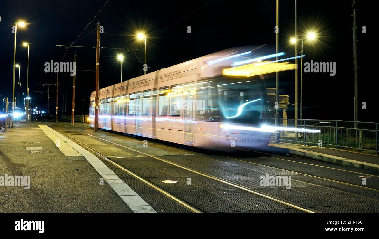Pink tram travelling along Blackpool seafront at night in winter Stock ...