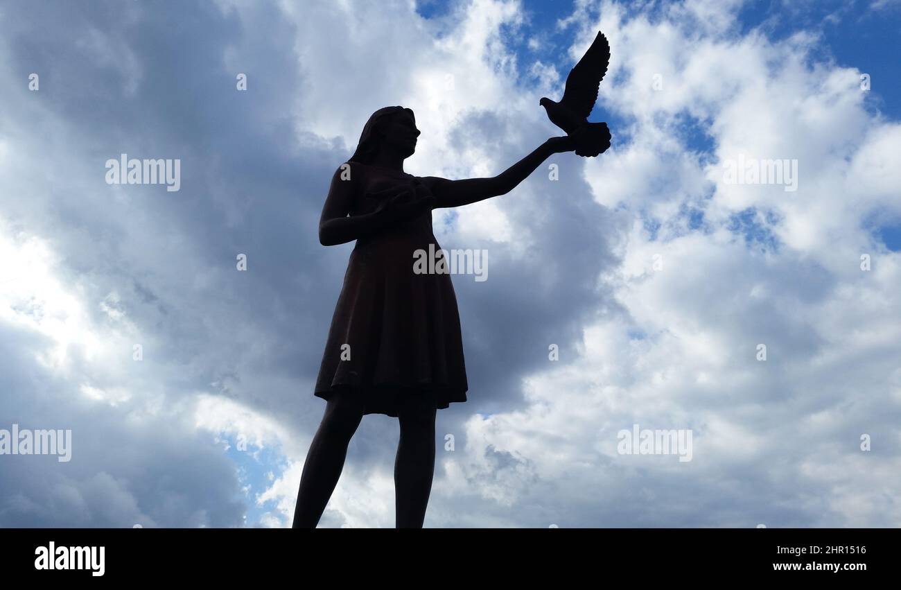 The girl statue is holding and releasing the bird to the freedom ...