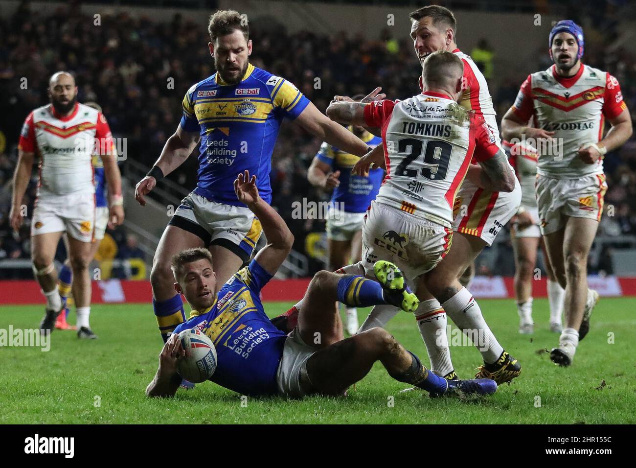 Jack Walker #1 of Leeds Rhinos breaks away from Sam Tomkins #29 of ...