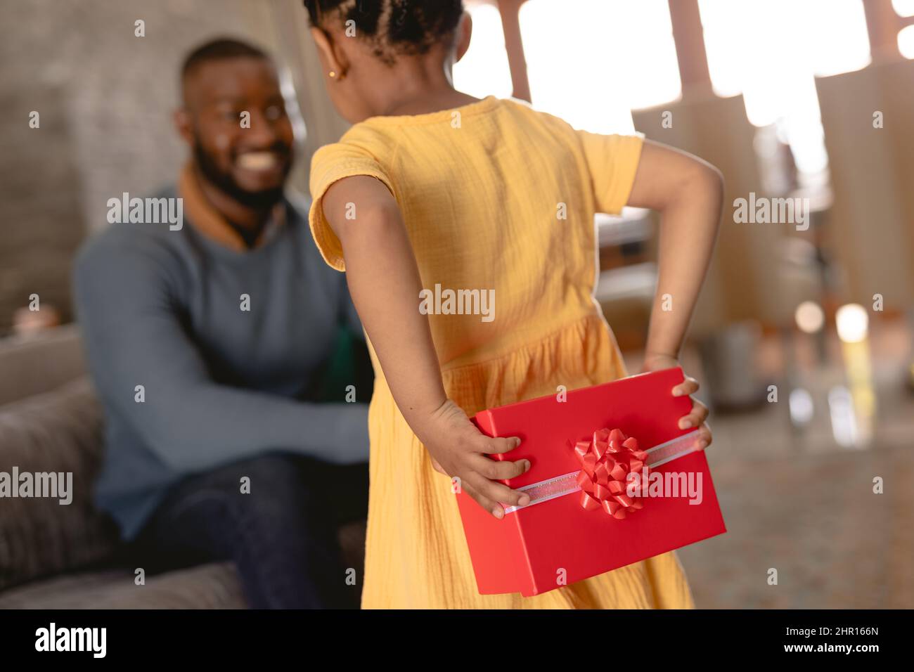 Behind present hi-res stock photography and images - Alamy