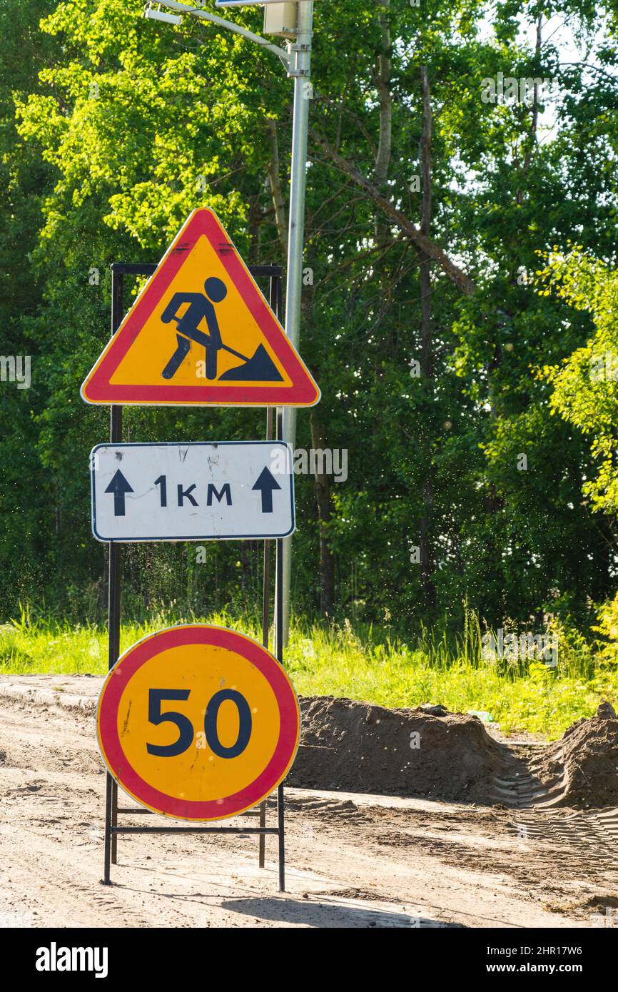 sign road works and speed limit on dangerous road section, road repair ...