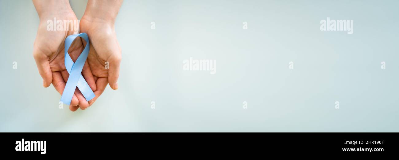 Human Hand Showing Teal Ribbon To Support Cervical Awareness Stock ...