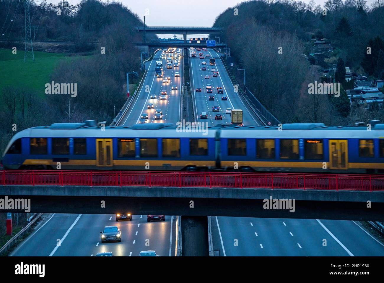 The A3 motorway, evening rush hour traffic on 6 lanes, local train S ...