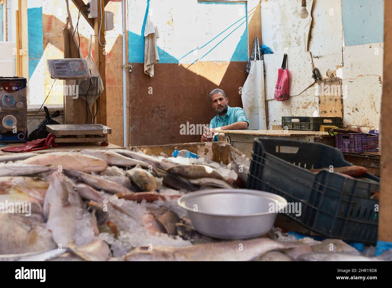 HURGHADA, EGYPT - FEBRUARY 19, 2022: Local fish seller sitting in the ...