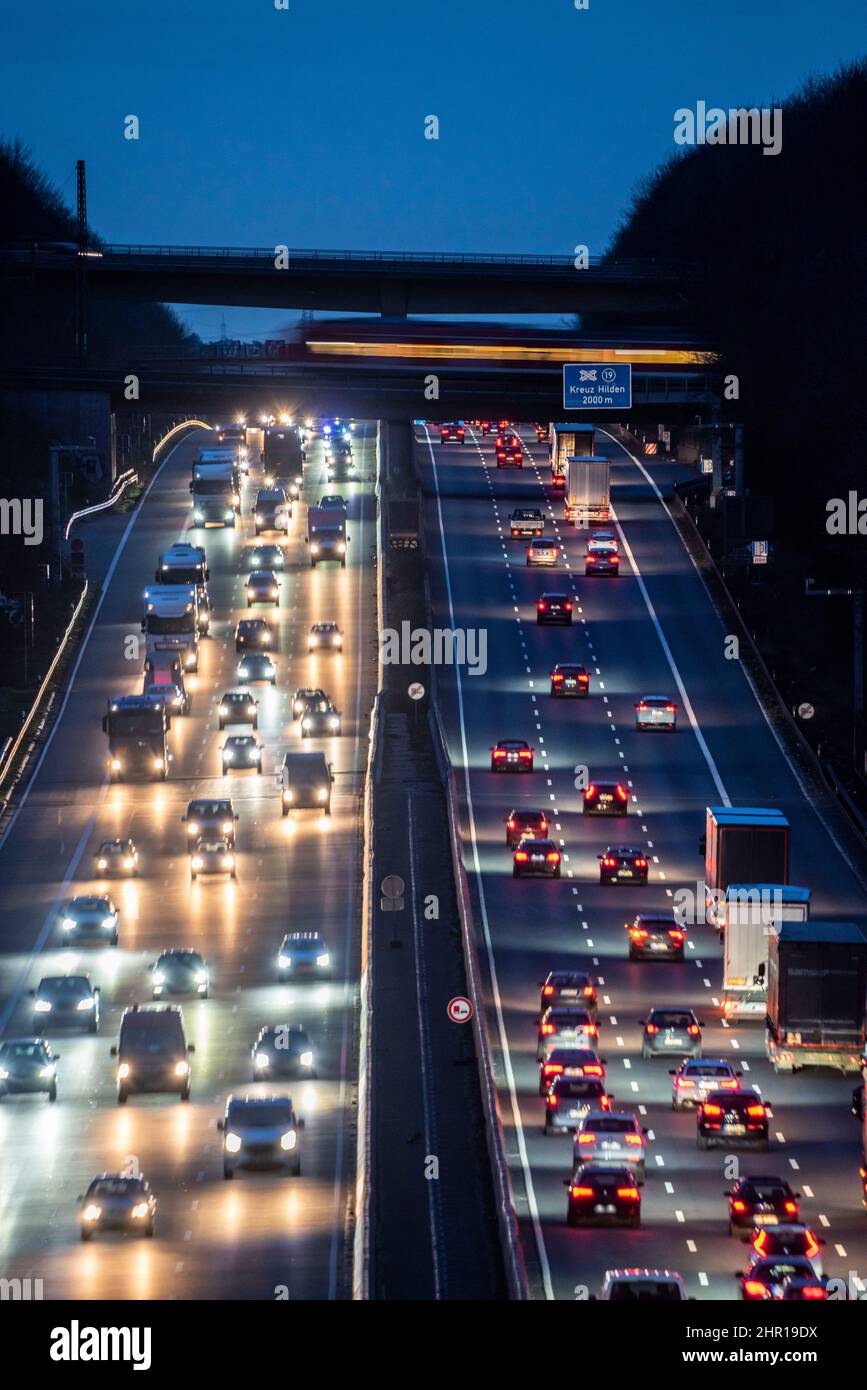 The A3 motorway, evening rush hour traffic on 6 lanes, local train S ...