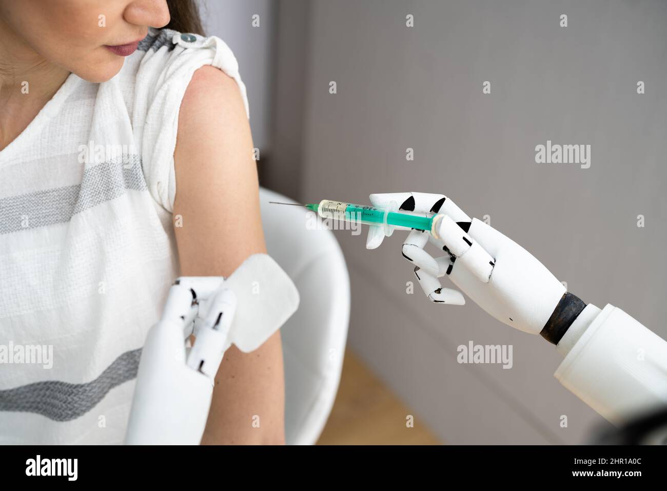 Robot Doctor Injecting Patient Arm With Vaccine Stock Photo - Alamy