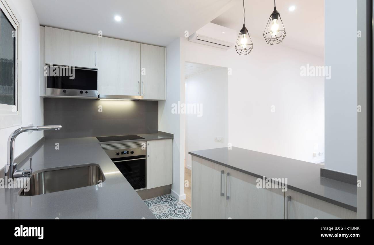 small white kitchen of an empty apartment Stock Photo - Alamy