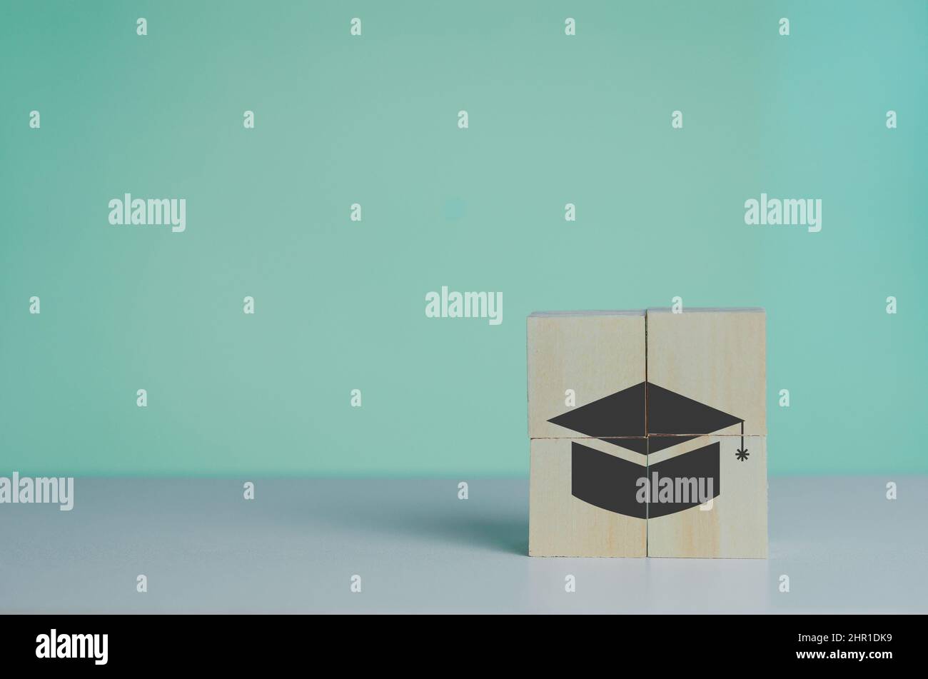Wooden cube with graduation cap icon.Education concept. Graduation day ...