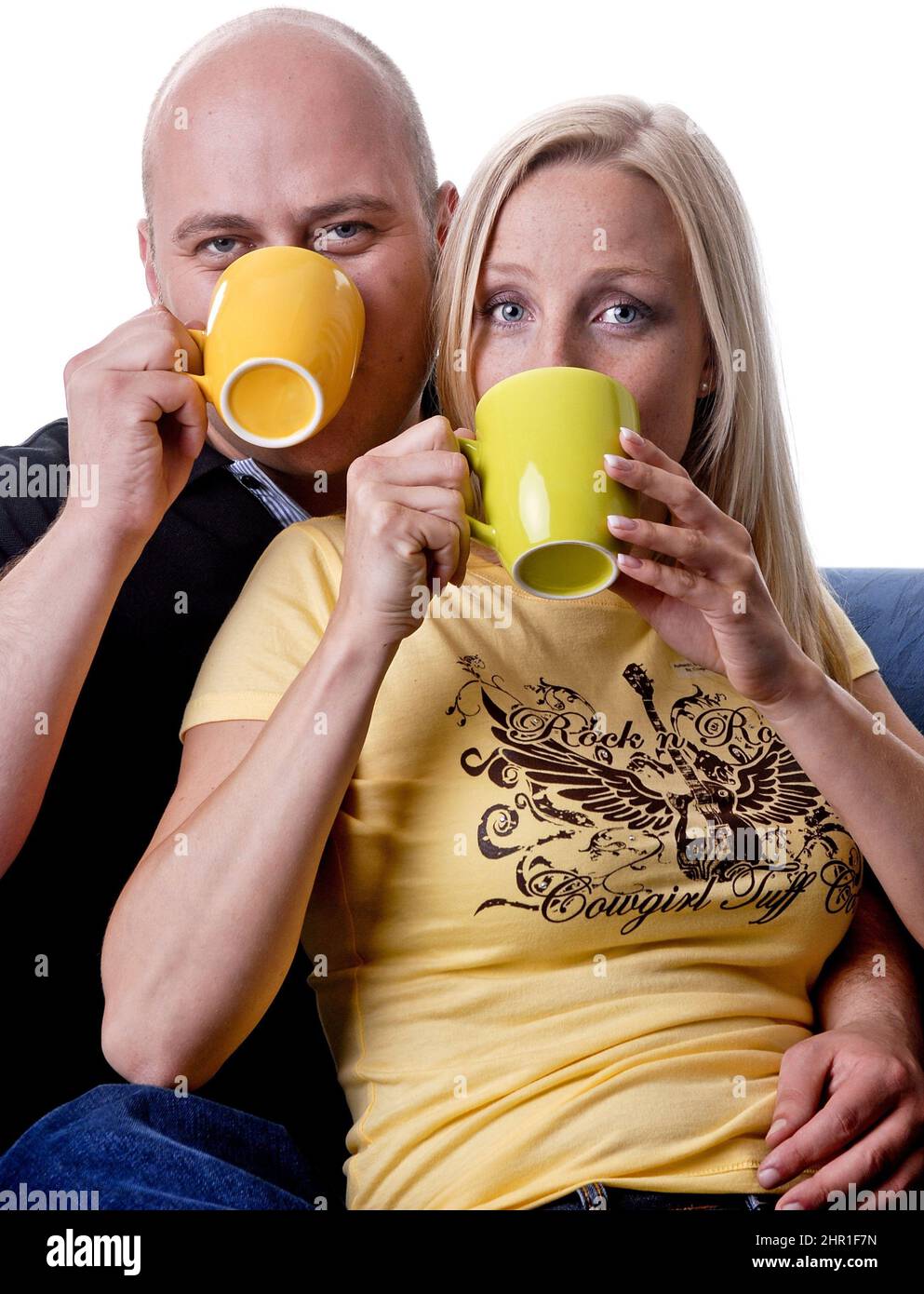 couple in love drinking a tea together on the sofa Stock Photo - Alamy