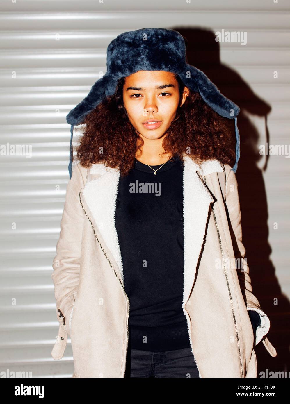 young pretty african american girl teenage outside on street, looking ...