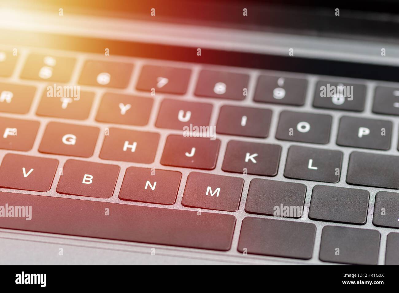 Keyboard in side angle focused on the letter M. Keyboard in shades of ...