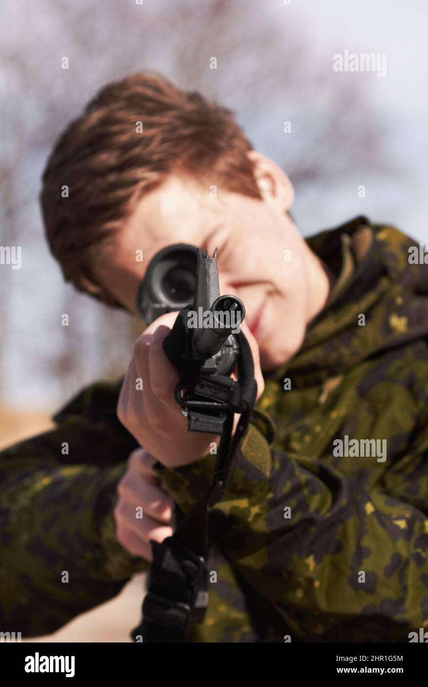 Perfect aim. A young soldier aiming his rifle at you Stock Photo - Alamy